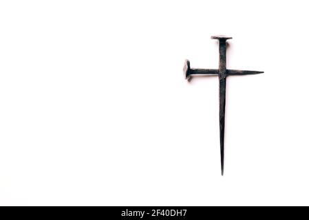 Christian cross made with rusty nails, drops of blood on grey ...