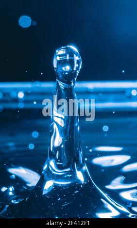 Colored water drop, circle ripples, splash of water, closeup Stock ...