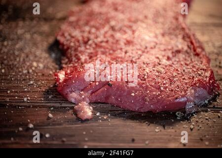 Mixed pepper and spices on the raw meat steak close up Stock Photo - Alamy