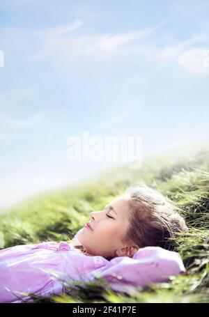 Little girl having a nap on her soft bed in bright modern room with ...