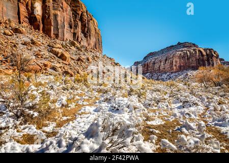 Dreamy winter landscape in Utah with red rocks and the Rocky Mountains ...