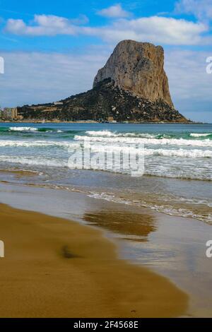 The Arenal beach and the Peñon de'Ifach above the Mediterranean Sea at ...