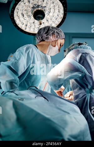 A team of surgeons is fighting for life, for a real operation, for real ...