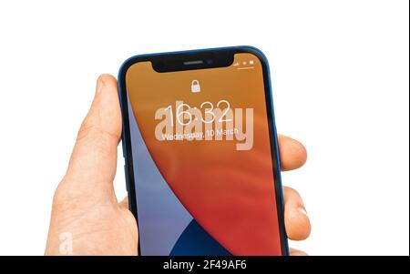 Kharkov, Ukraine - March 12, 2021: Apple iPhone 12 with locked screen ...