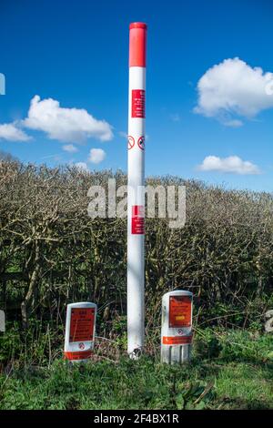 gas pipeline marker posts Stock Photo - Alamy
