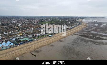 A family on the beach at Thorpe Bay in Southend on Sea in Essex, UK ...