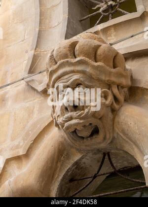 Keystone of a grotesque face of a Moor wearing a turbante over a door ...