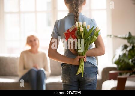 Emotional teenager child hold gift on birthday. Funny kid girl holding ...