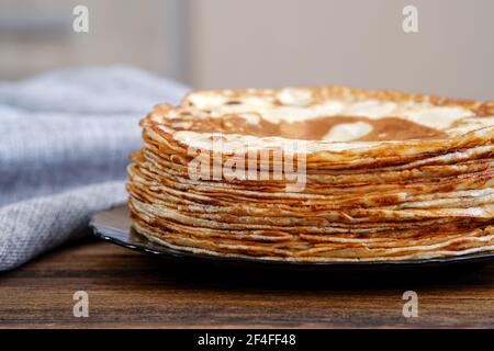 A tall stack of pancakes. Breakfast for the whole family. Maslenitsa ...