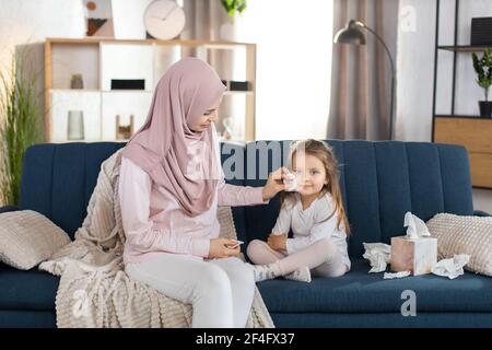 Happy muslim family cleans the room together Stock Photo - Alamy