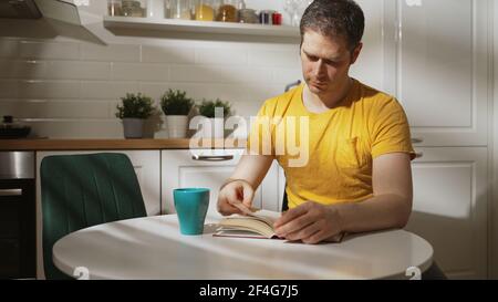 Man reading book early in the morning Stock Photo - Alamy