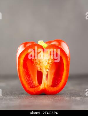 Red bell pepper cross section on white background Stock Photo - Alamy