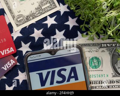 In this photo illustration, VISA logo seen displayed on a smartphone ...