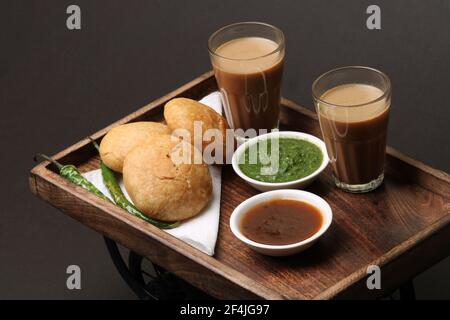 Indian snakes food kachouri or kachoudi kachori served with tamarind ...