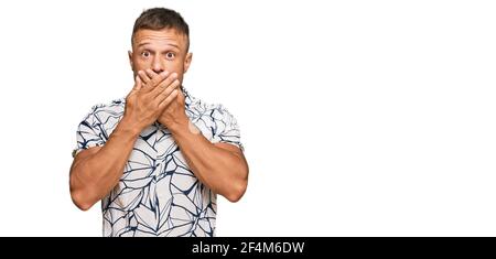 Handsome muscle man wearing casual white tshirt looking stressed and ...