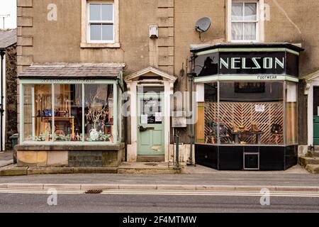 Nelson's shoemaker shopfront in Settle, North Yorkshire with decorated ...