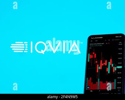 In this photo illustration, the IQVIA logo is displayed on a smartphone ...