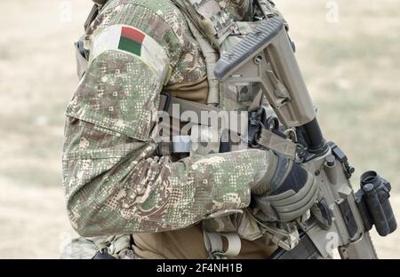 Flag of Madagascar on military uniform. Army, troops, soldiers. Collage ...