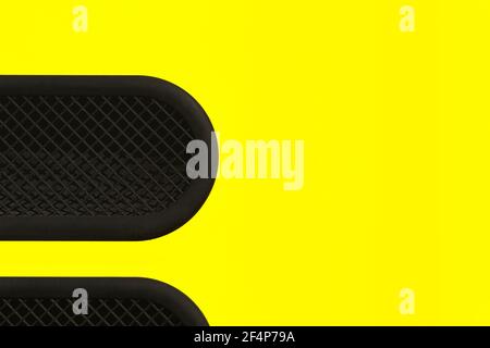 Black-colored ventilation ducts on the yellow-colored electrical panel ...