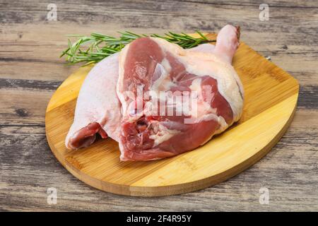 Raw duck leg served rosemary for cooking Stock Photo - Alamy