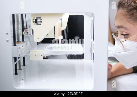 3D bioprinter ready to 3D print cells onto an electrode. Biomaterials ...
