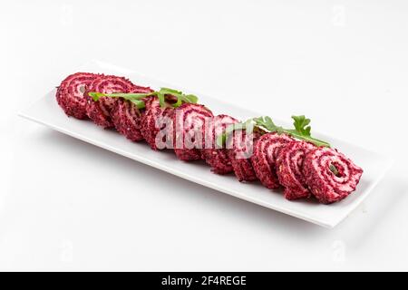 Isolated sliced beetroot appetizer roll platter Stock Photo - Alamy