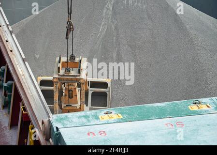Loading and dischargind operation of bulk cargo bauxite on bulk carrier ship using grab bucket ...