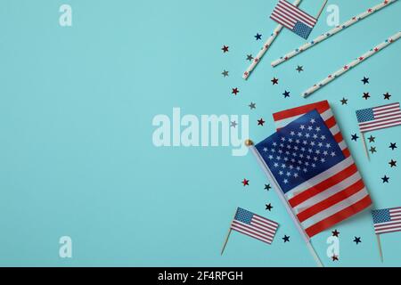 American flag, glitter and straws on blue background Stock Photo - Alamy