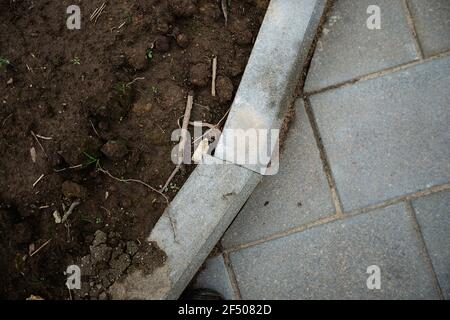 sagging paving stones. uneven pavement in the city square. sinking ...
