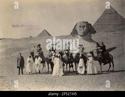 Giza (Egypt). Tourists and native leaders with camels in front of the ...