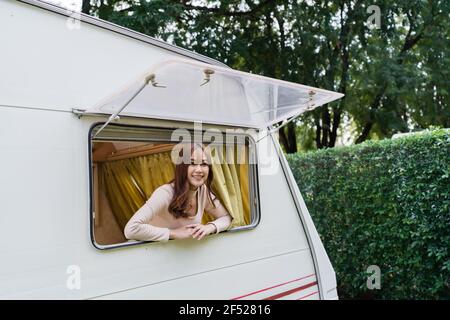 RV camper van travel Asian girl sitting in back of motorhome car on ...