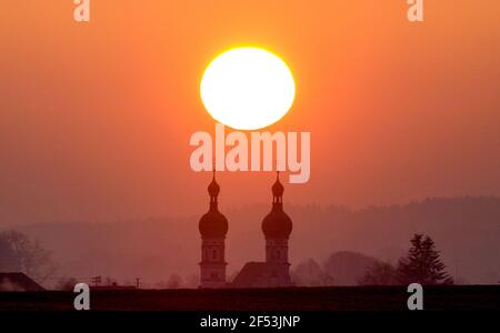 Uttenweiler, Germany. 24th Mar, 2021. Storks flying over a nature ...