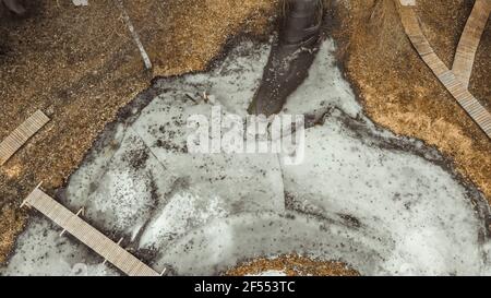 An aerial shot of a small bridge over a river in Heerenveen town ...