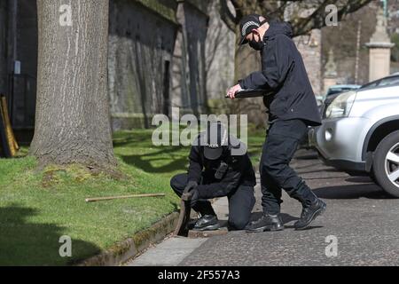 Police officers conduct a search outside the Palace of Holyroodhouse in ...