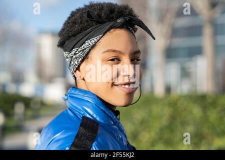 Close-up image, A hipster female in a flannel shirt writing something ...