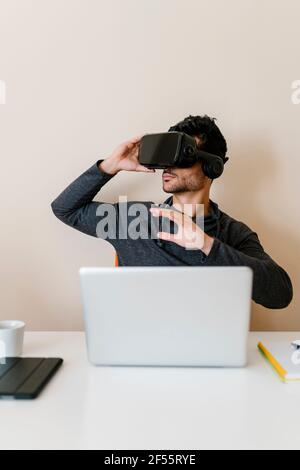 man sitting at the table gaming laptop Lifestyle technology Stock Photo ...