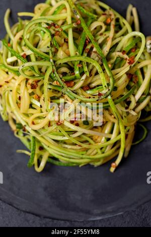 Zucchini spaghetti with dehydrated pepperoni pepper Stock Photo - Alamy