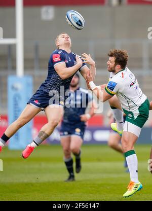 Sale Sharks wing Aaron Reed competes for a high ball with London Irish ...