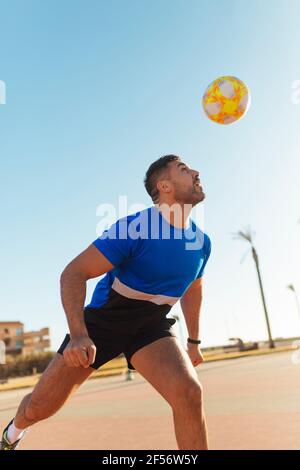 one caucasian man heading playing soccer football player silhouette in ...