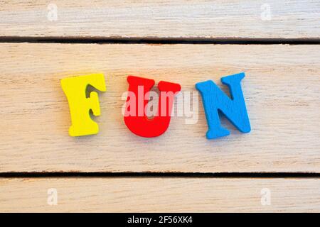 Word fun spelt with wooden letters Stock Photo - Alamy