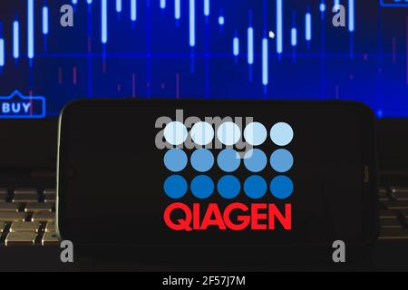 In this photo illustration a Qiagen logo seen displayed on a smartphone ...