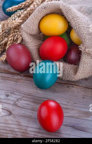Painted eggs in a linen sack for the celebration of Easter Stock Photo ...