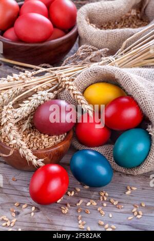 Painted eggs in a linen sack for the celebration of Easter Stock Photo ...