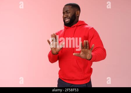 Awkward african american guy step back cringing dislike unwilling go ...