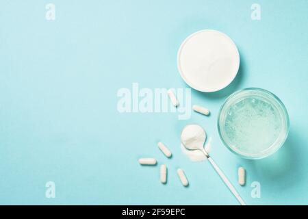 Collagen powder dietary supplement at blue Stock Photo - Alamy