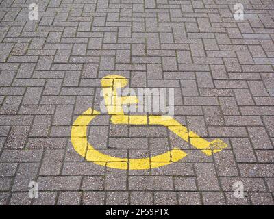 a disabled parking bay with wheelchair sign and parking distance ...