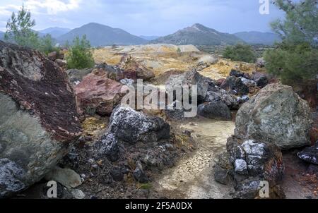 Piles of multicolored waste rocks and tailings near abandoned Memi mine ...