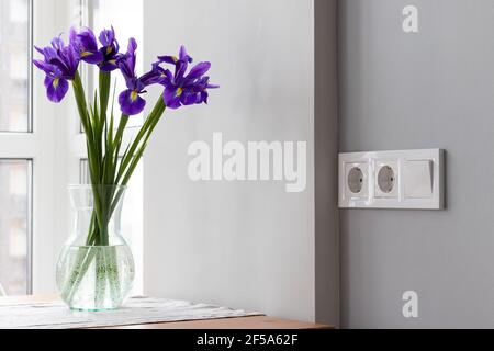 Group of white european electrical outlets with plug on gray concrete ...