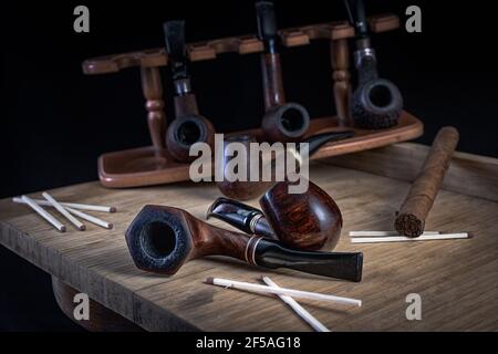 Smoking pipes of different shapes and types in a special rack Stock ...