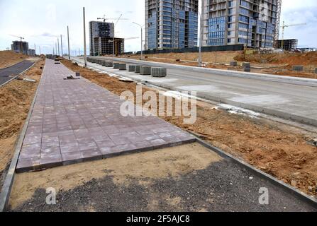 Process of installing paving bricks in the town pedestrian zone. Laying ...